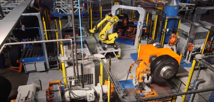 Bead-to-bead truck tire retreading robotic building island | Tire ...